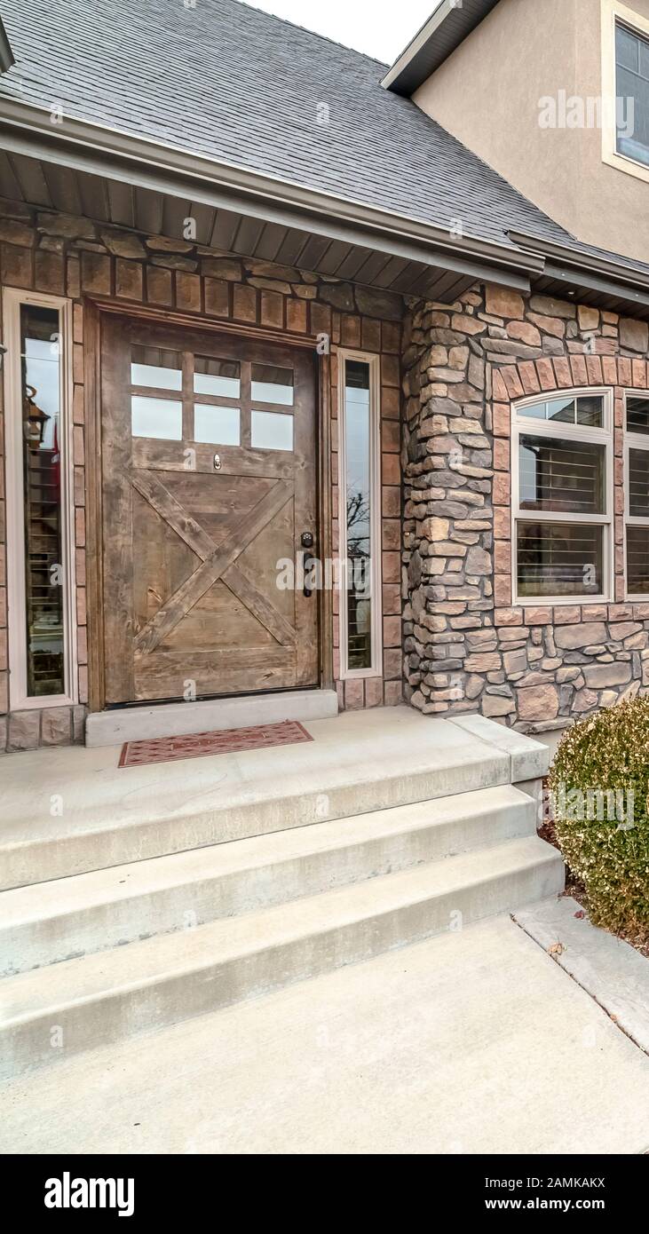Vertical Modern urban home with feature stone brick wall Stock Photo ...