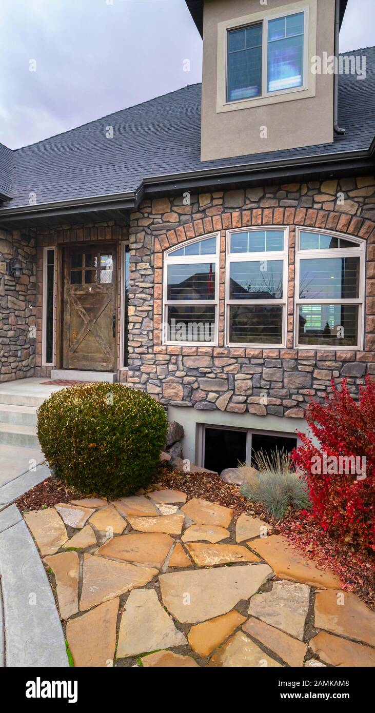 Vertical Neat front footpath and garden to an urban home Stock Photo ...