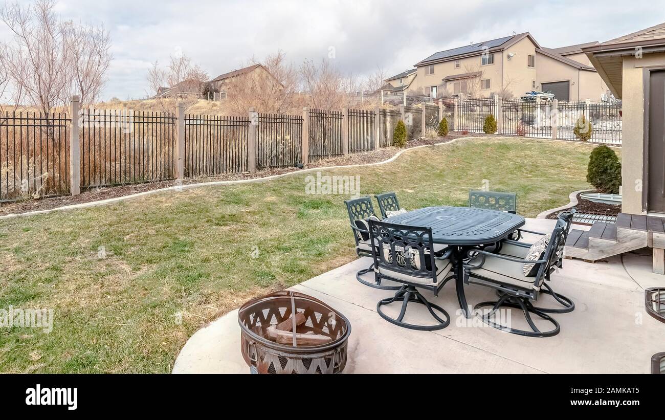 Panorama frame Outdoor paved patio with dining furniture day light ...