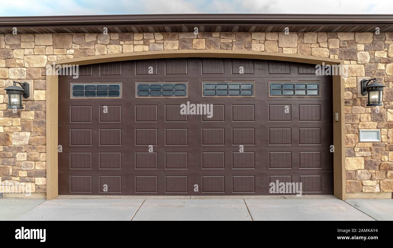 Panorama frame Large garage with double brown wooden door Stock Photo ...