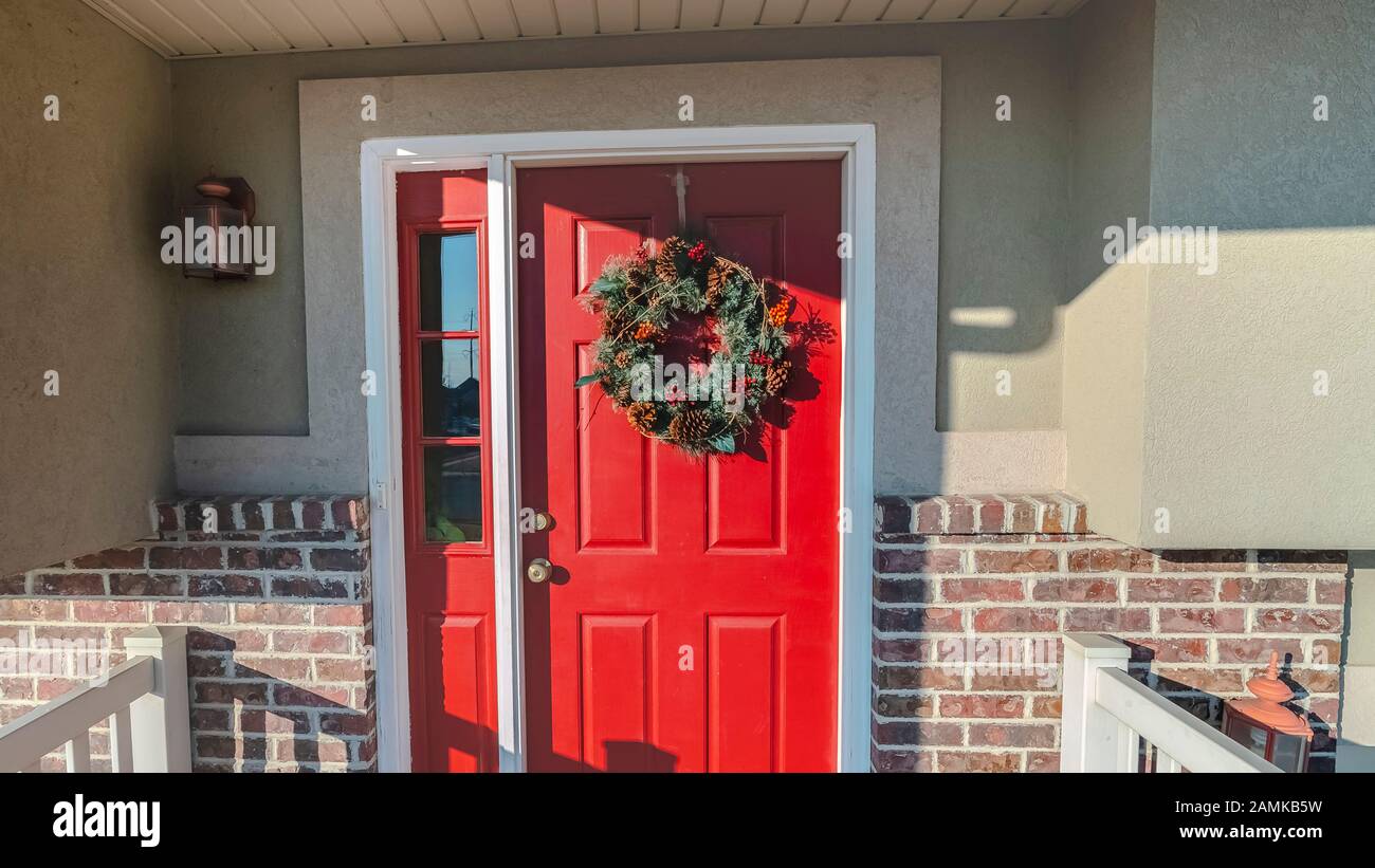 Panorama frame Bright red entrance door with wreath day light Stock ...