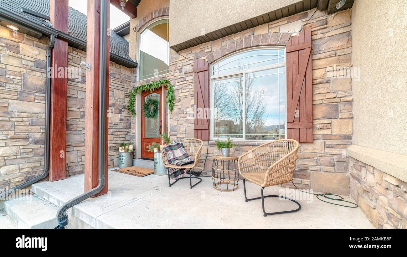 Panorama frame Exterior patio with two wicker comfy chairs Stock Photo ...