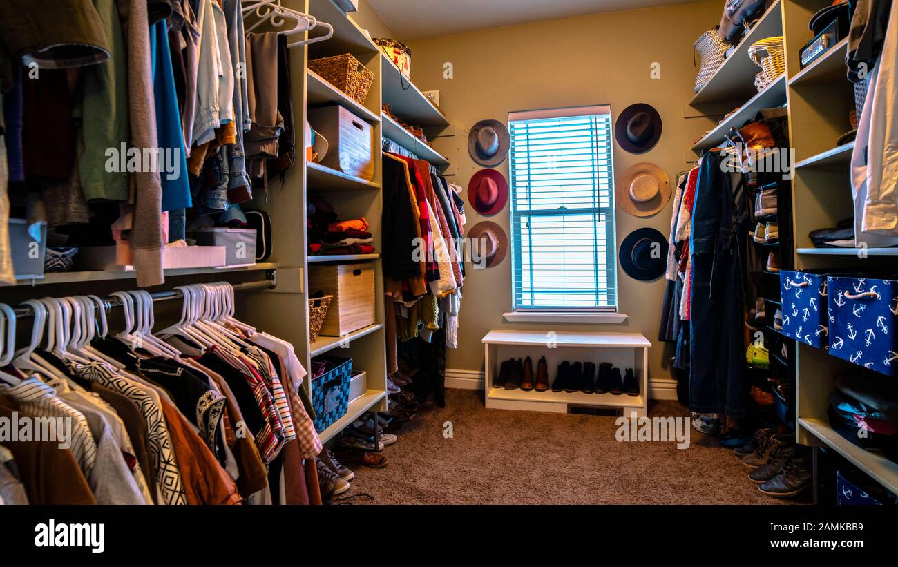 Panorama frame Neat walk-in closet full of clothes day light Stock ...