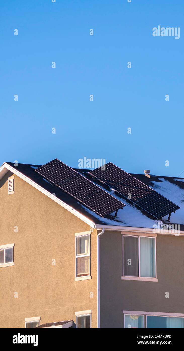 Vertical Two angled solar panels on a house roof Stock Photo - Alamy