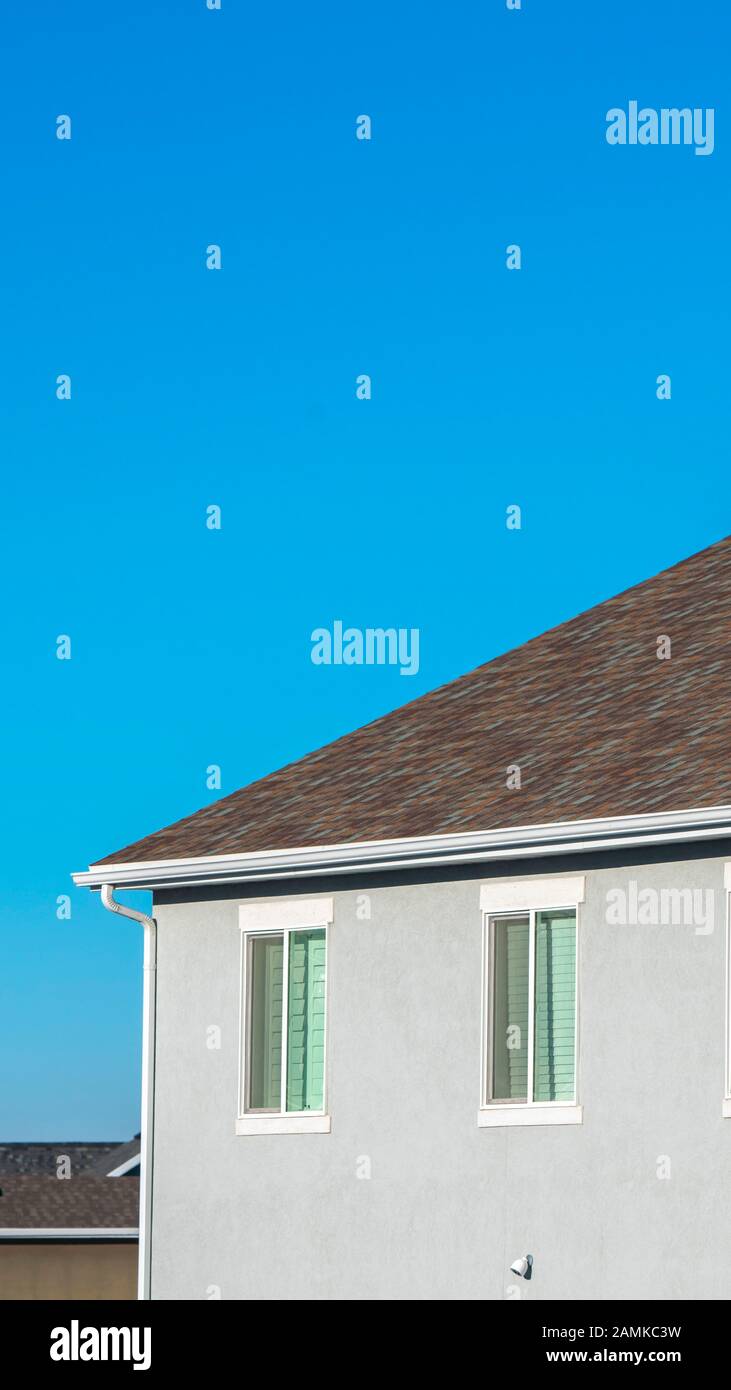 Vertical frame Upstairs windows in a double storey house Stock Photo ...