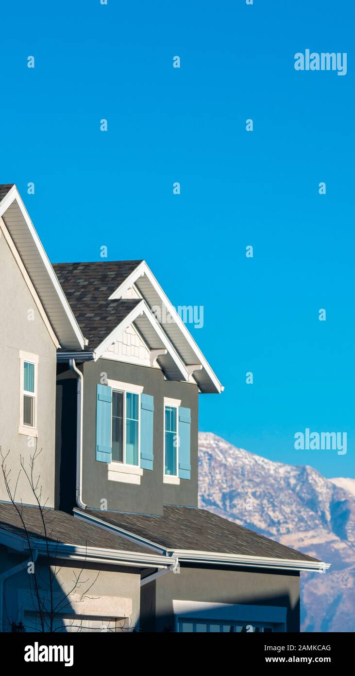 Vertical frame House facades and snowy mountains in Utah Valley Stock ...