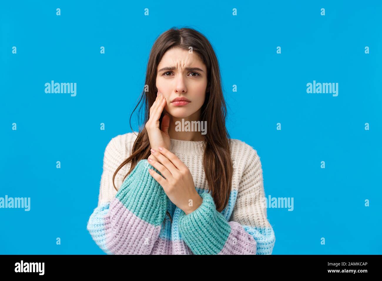 Waist-up portait sad silly girl having troubles with teeth, frowning ...