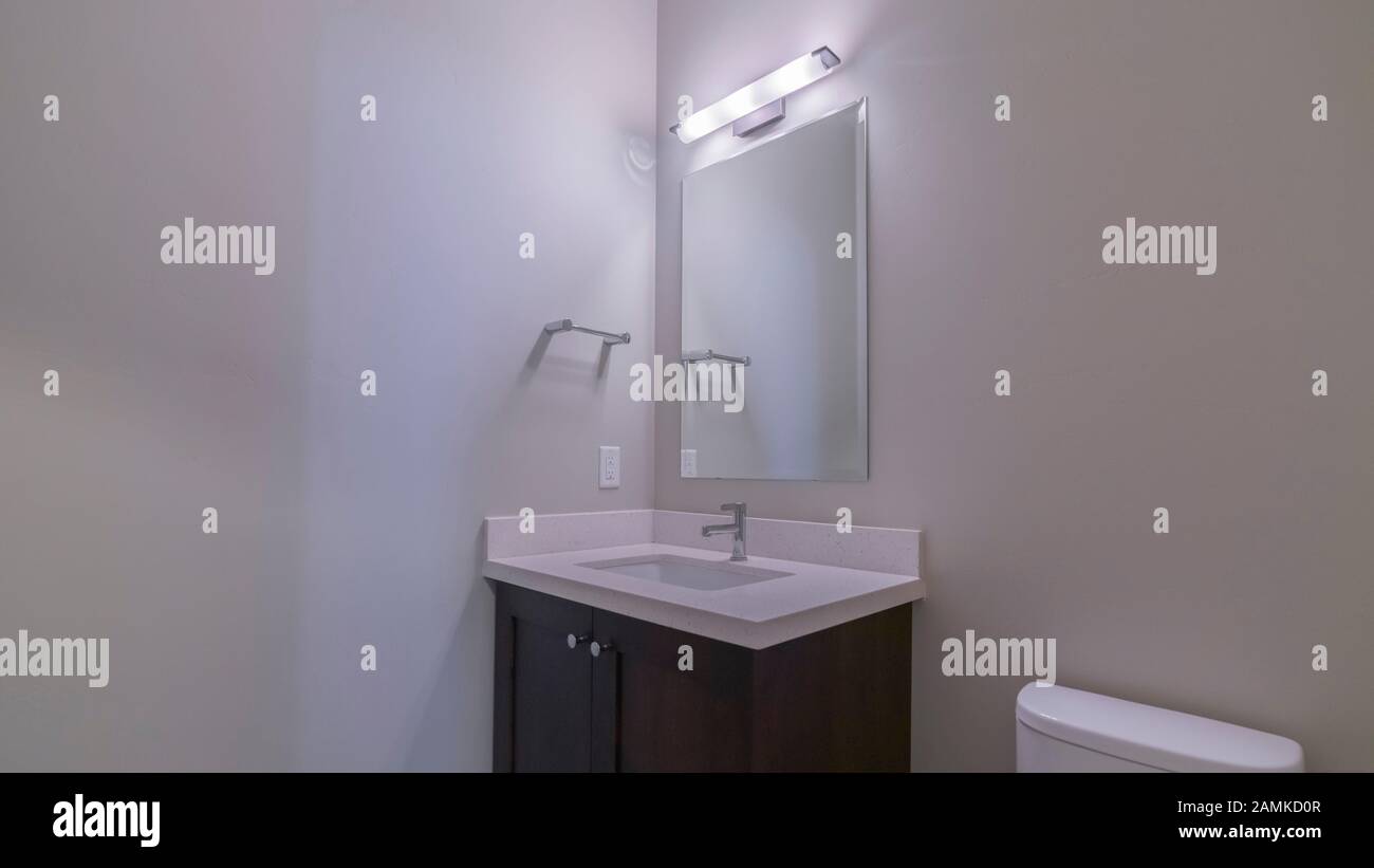 Panorama Small hand basin and mirror in a toilet Stock Photo - Alamy