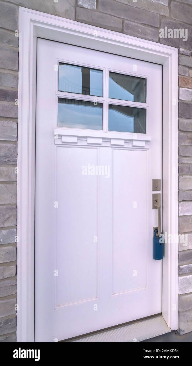 Vertical White wooden front door with sash windows Stock Photo - Alamy