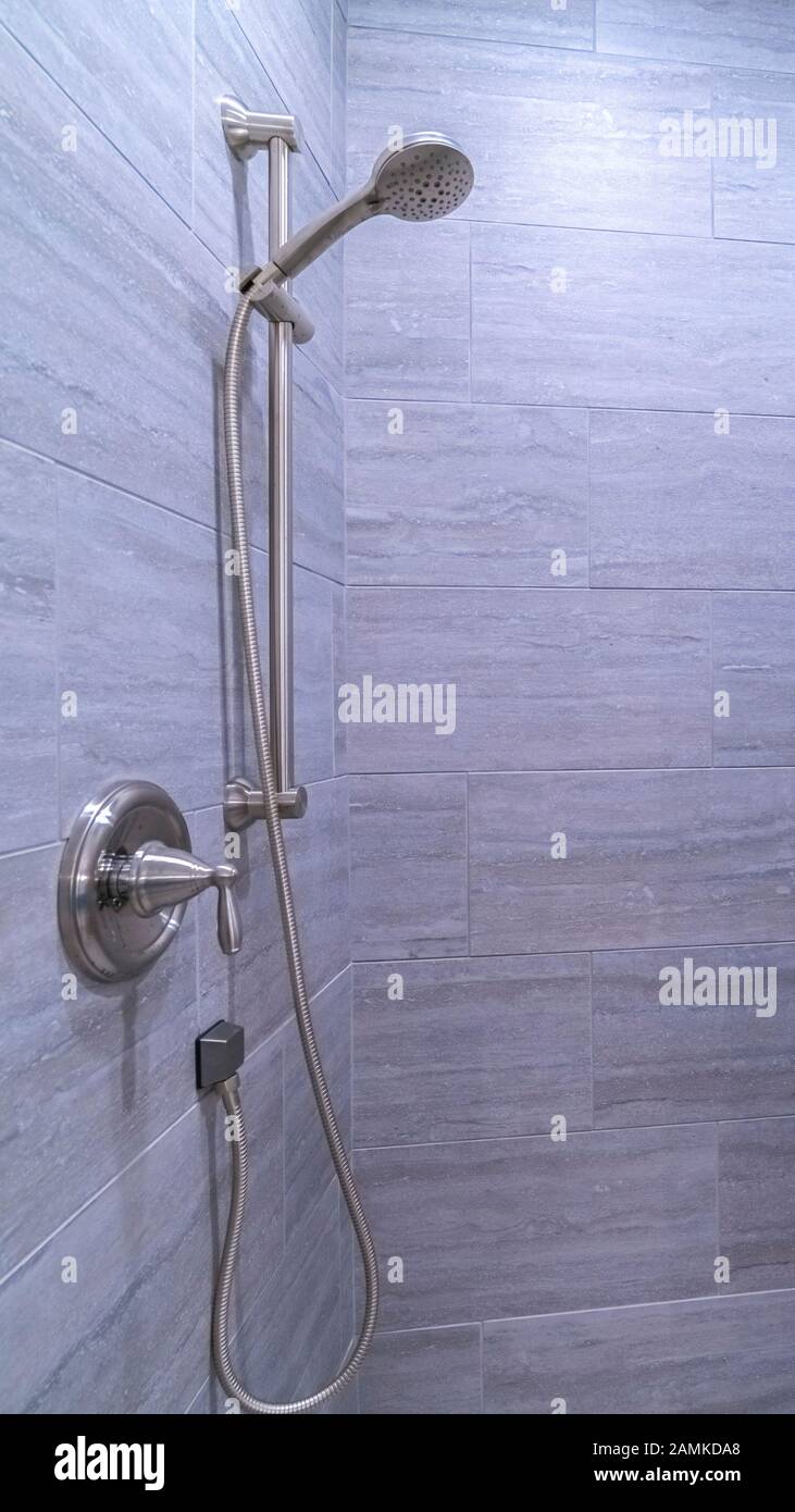 Vertical frame Tiled shower cubicle with dual heads bright interior ...