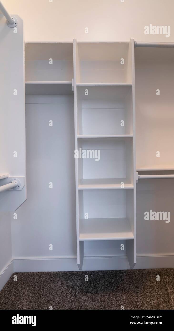 Vertical frame Fitted interior of a walk-in wardrobe bright interior ...