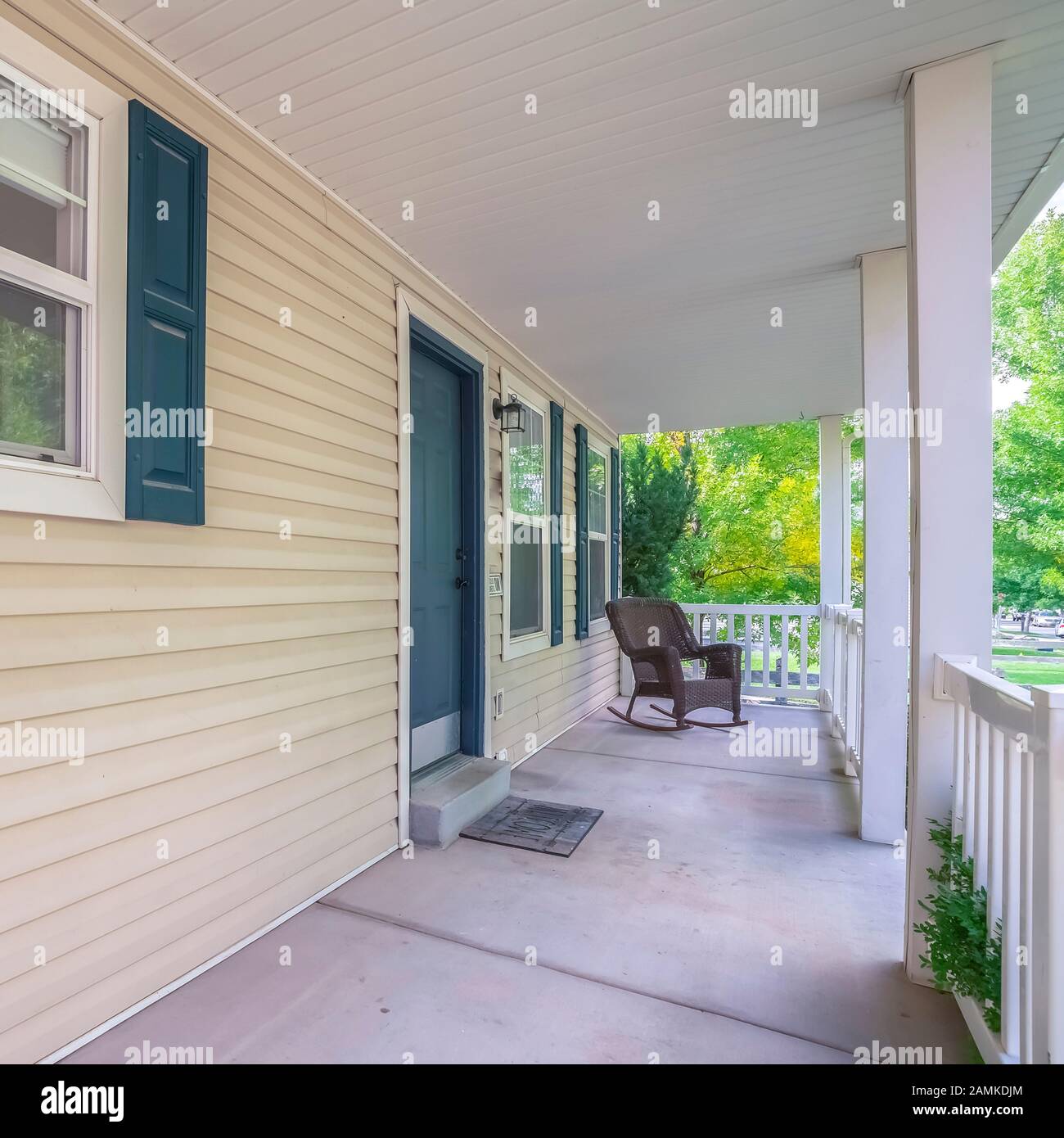 Square Long covered veranda in front of a timber house Stock Photo - Alamy