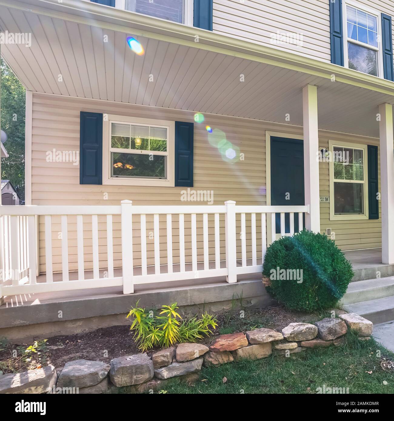 Square frame White timber house with shutters and veranda Stock Photo ...