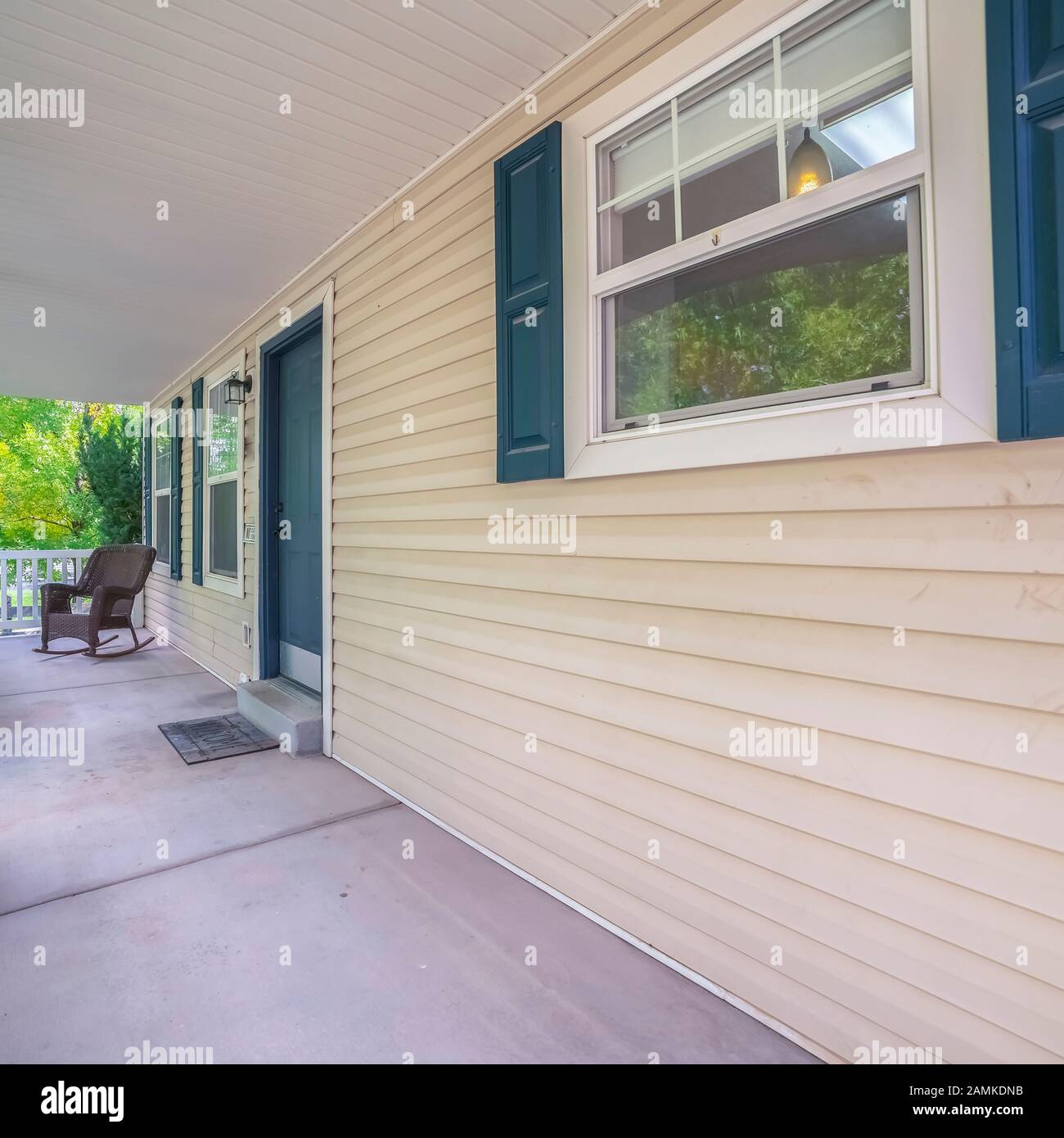 Square frame Long covered veranda in front of a timber house Stock ...