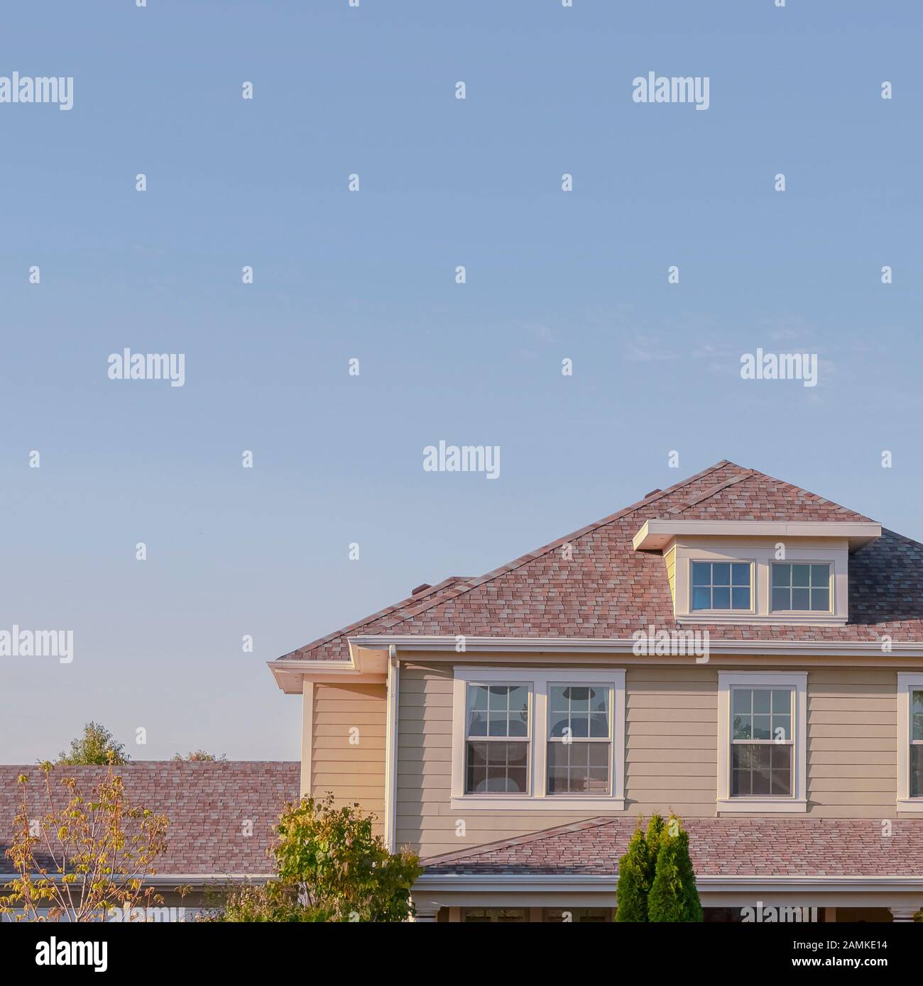 Square frame Street view of a modern timber clad house Stock Photo - Alamy