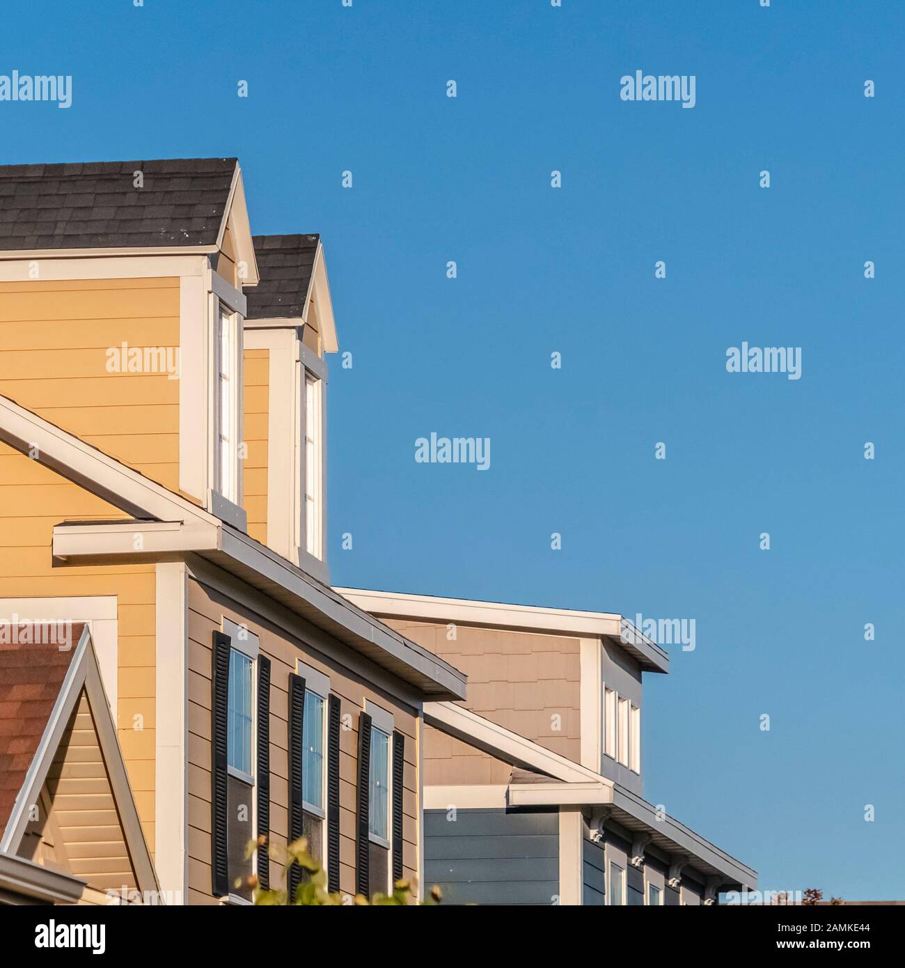 Square Row of upper floor facades of urban homes Stock Photo - Alamy
