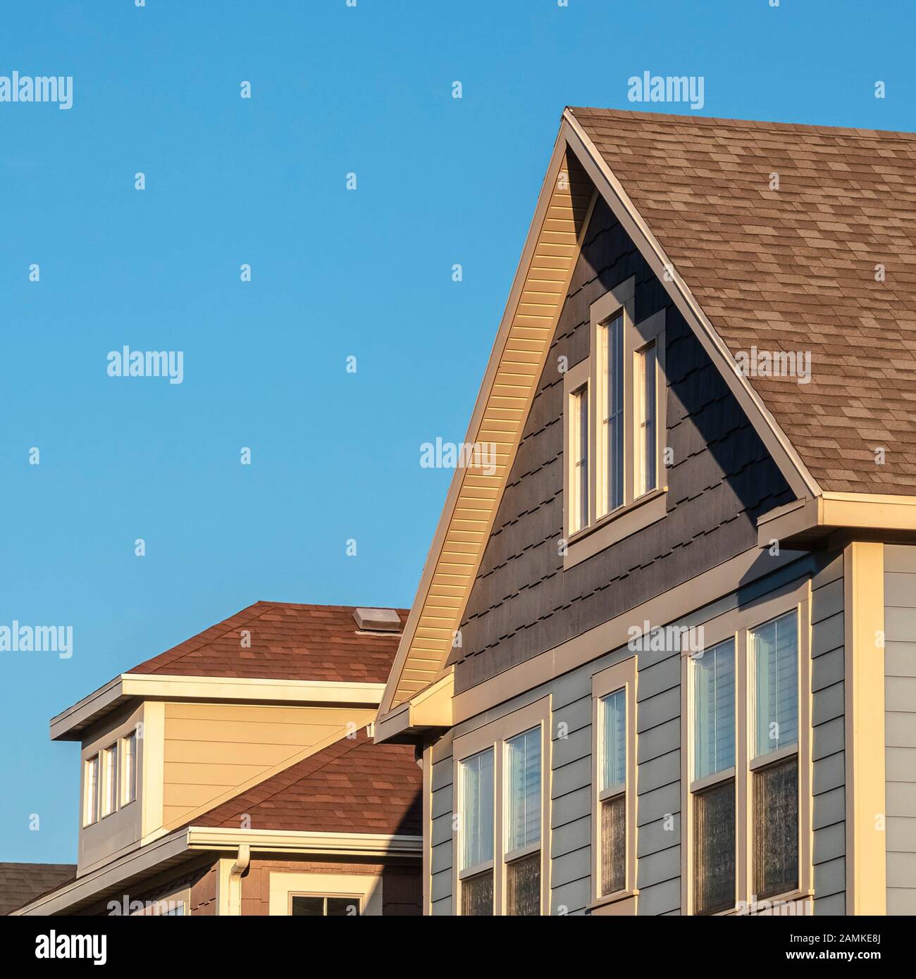 Square frame Upper facades of a row of timber clad houses Stock Photo ...