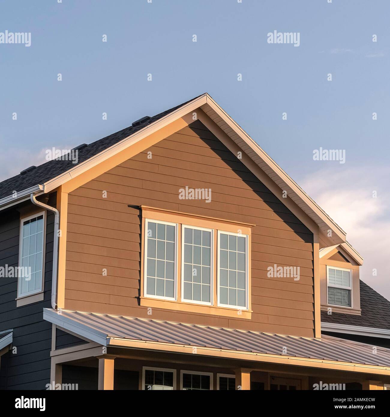 Square frame Brown double storey house facade in evening light Stock ...