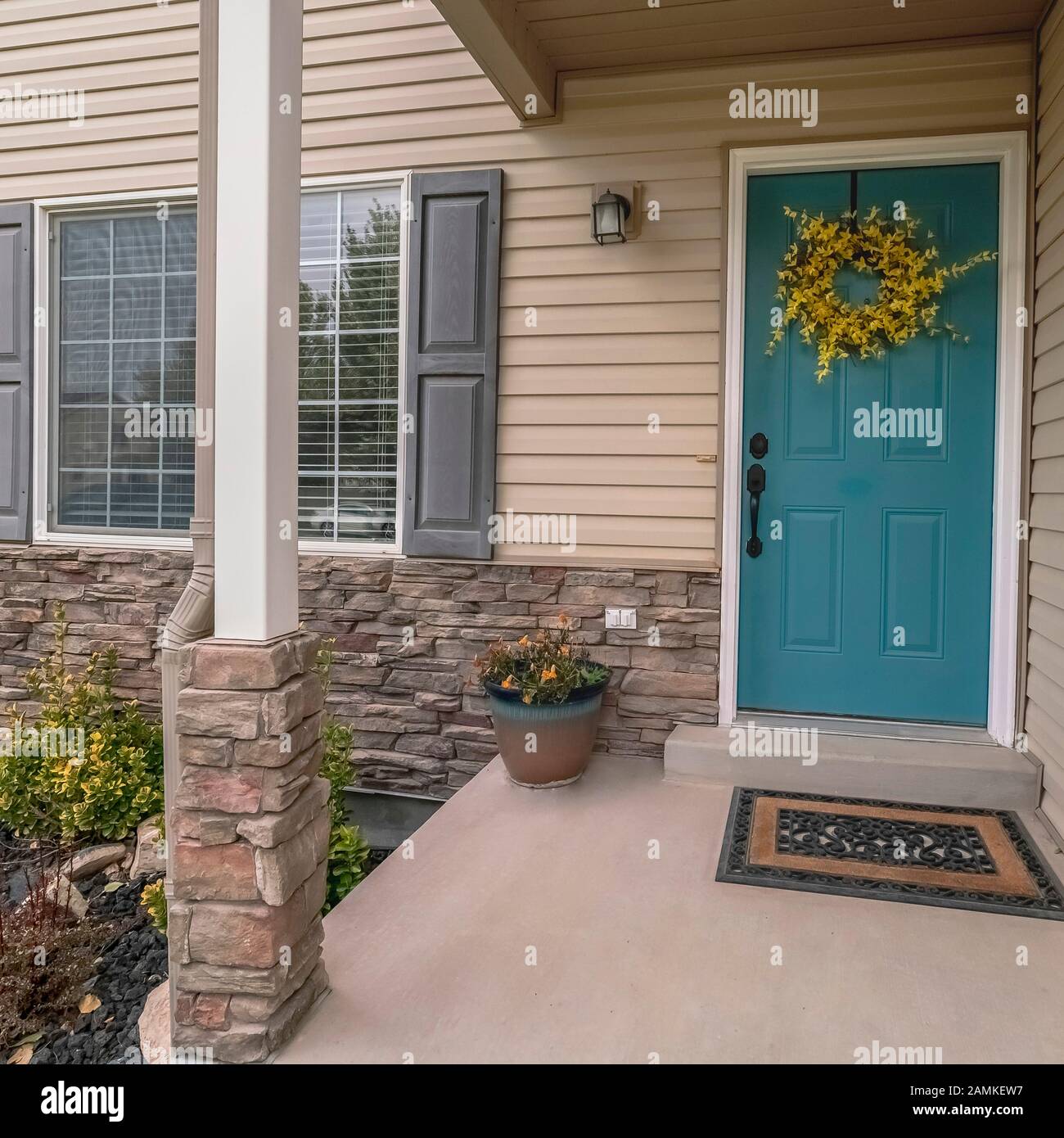 Square frame Colorful blue wooden front door with wreath Stock Photo ...