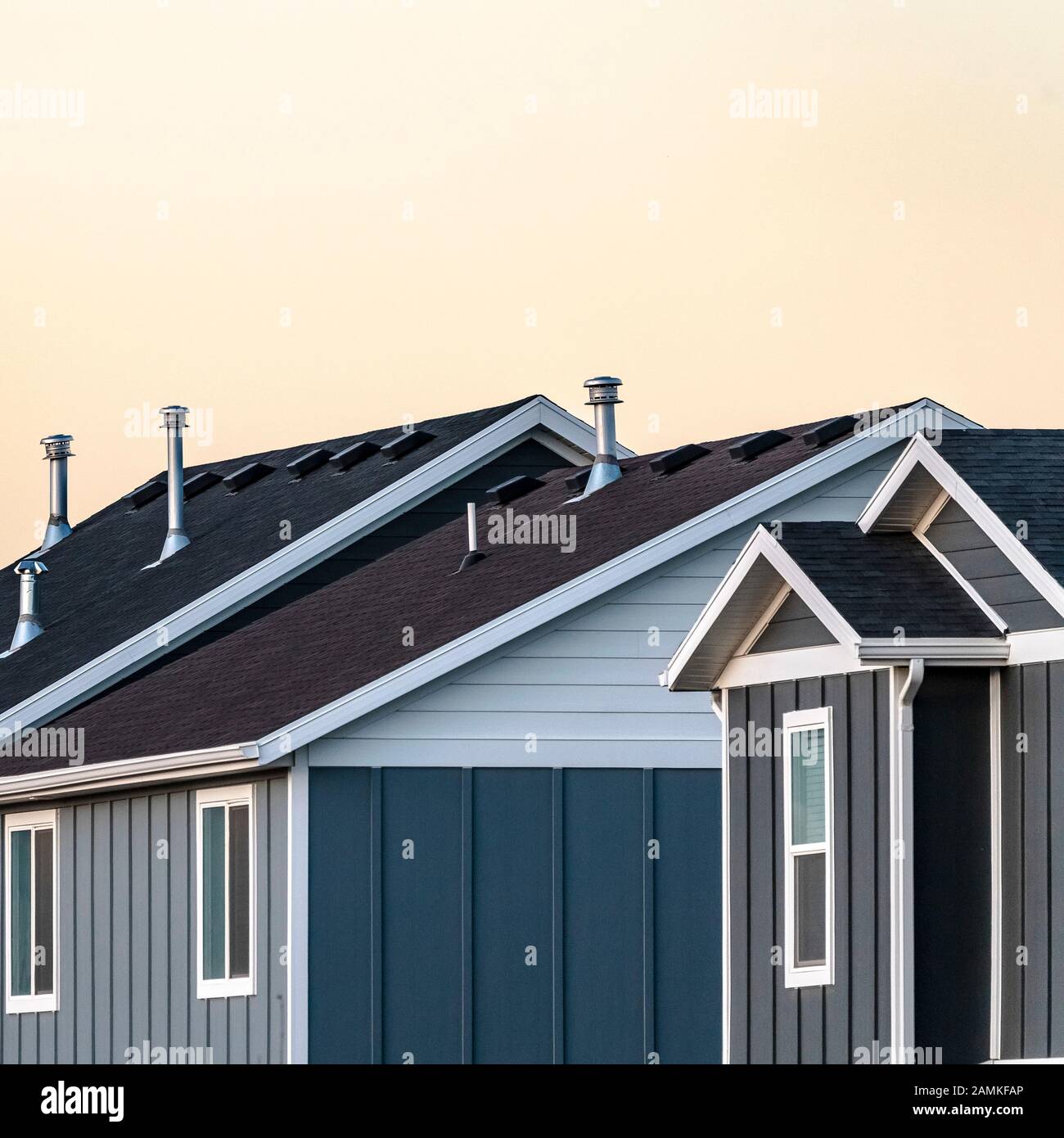 Square Roofs of modern urban houses at sunset Stock Photo - Alamy