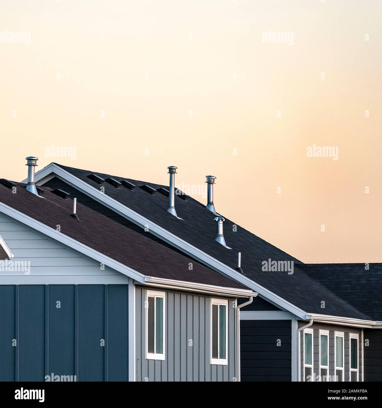 Square frame Roofs of modern urban houses at sunset Stock Photo - Alamy