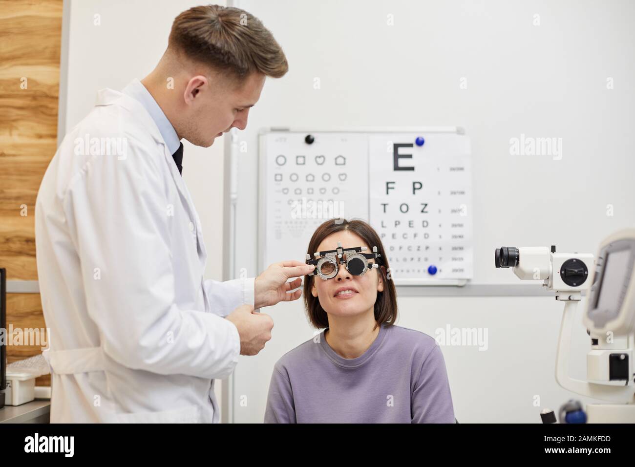 Putting on eye glasses hi-res stock photography and images - Alamy