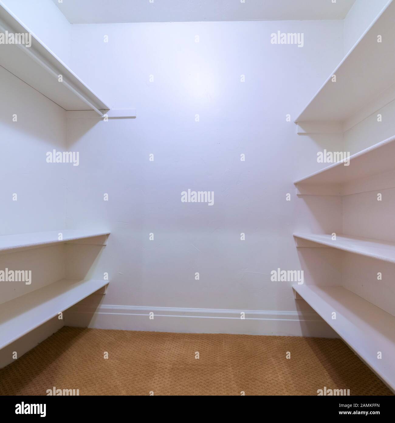Square White walk-in closet or wardrobe bright interior Stock Photo - Alamy