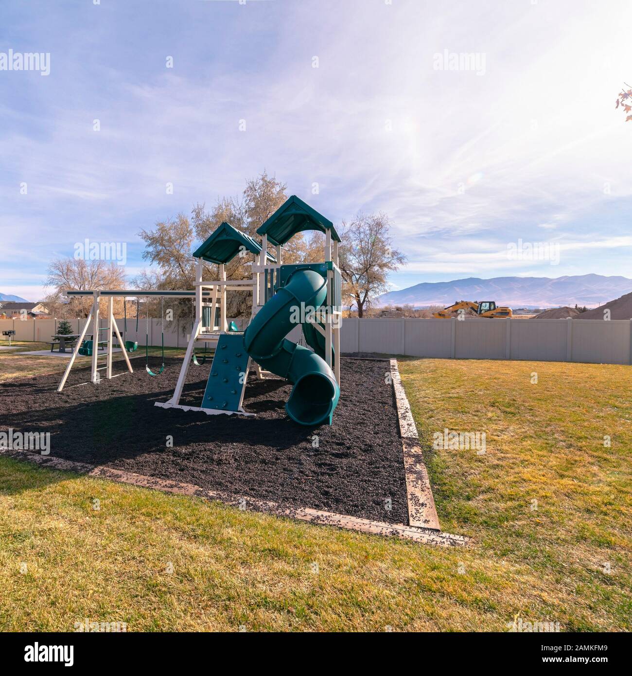 Square frame Kids playground in a walled park or estate Stock Photo - Alamy