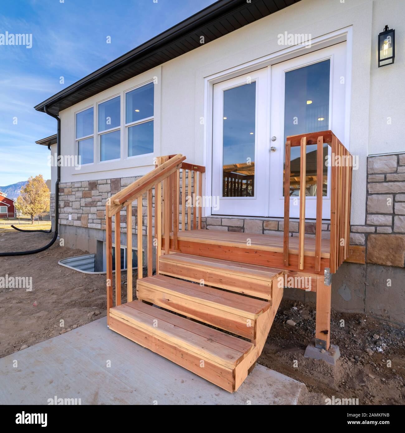 Square Wooden steps and deck on a modern house Stock Photo - Alamy