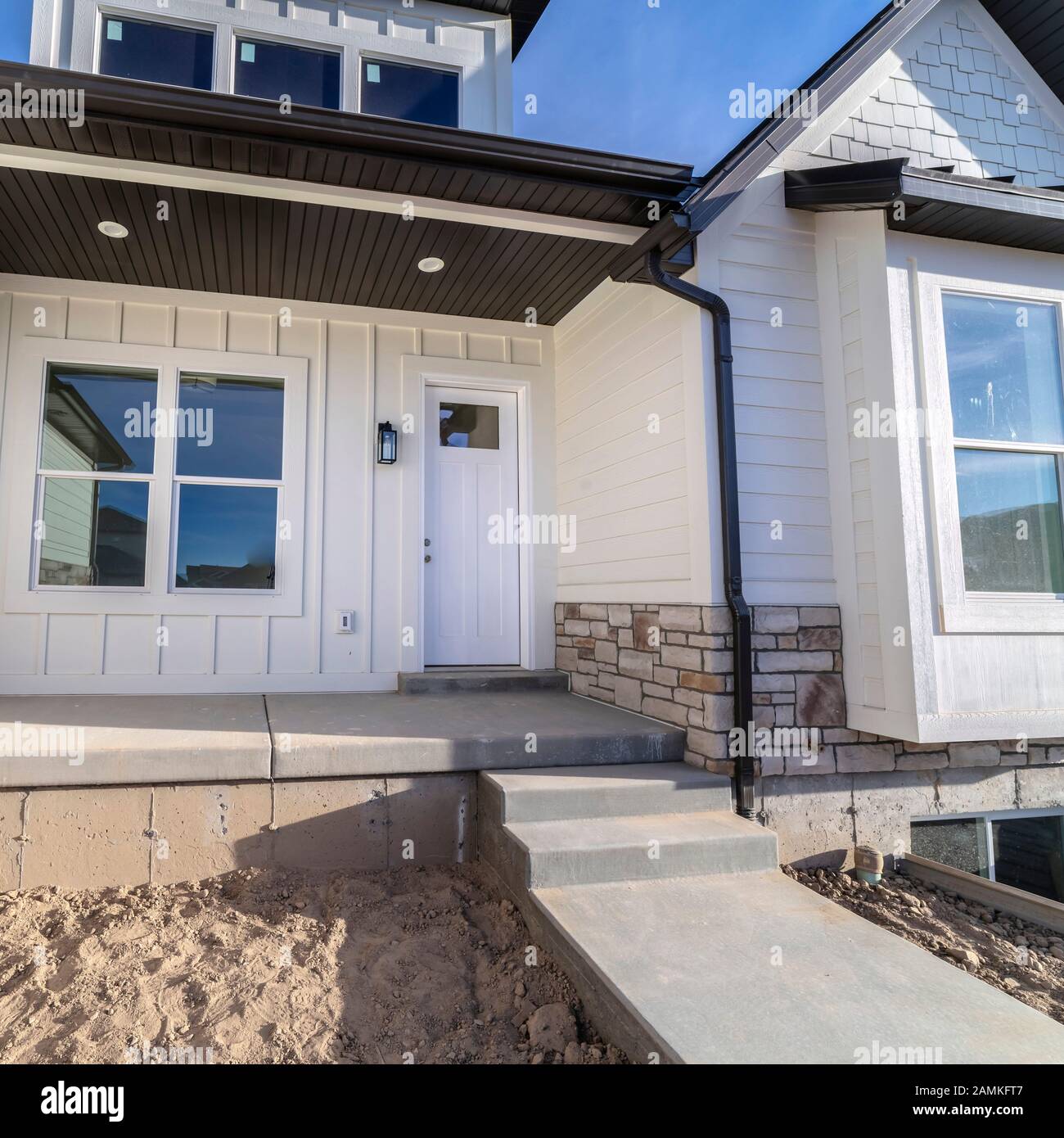 Square Front facade of a new built town house Stock Photo - Alamy