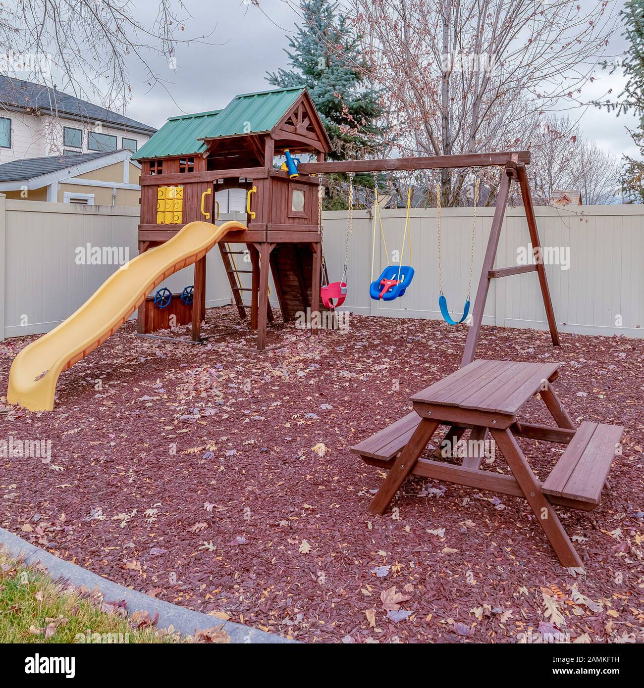 Square Small kids playground in a private backyard Stock Photo - Alamy