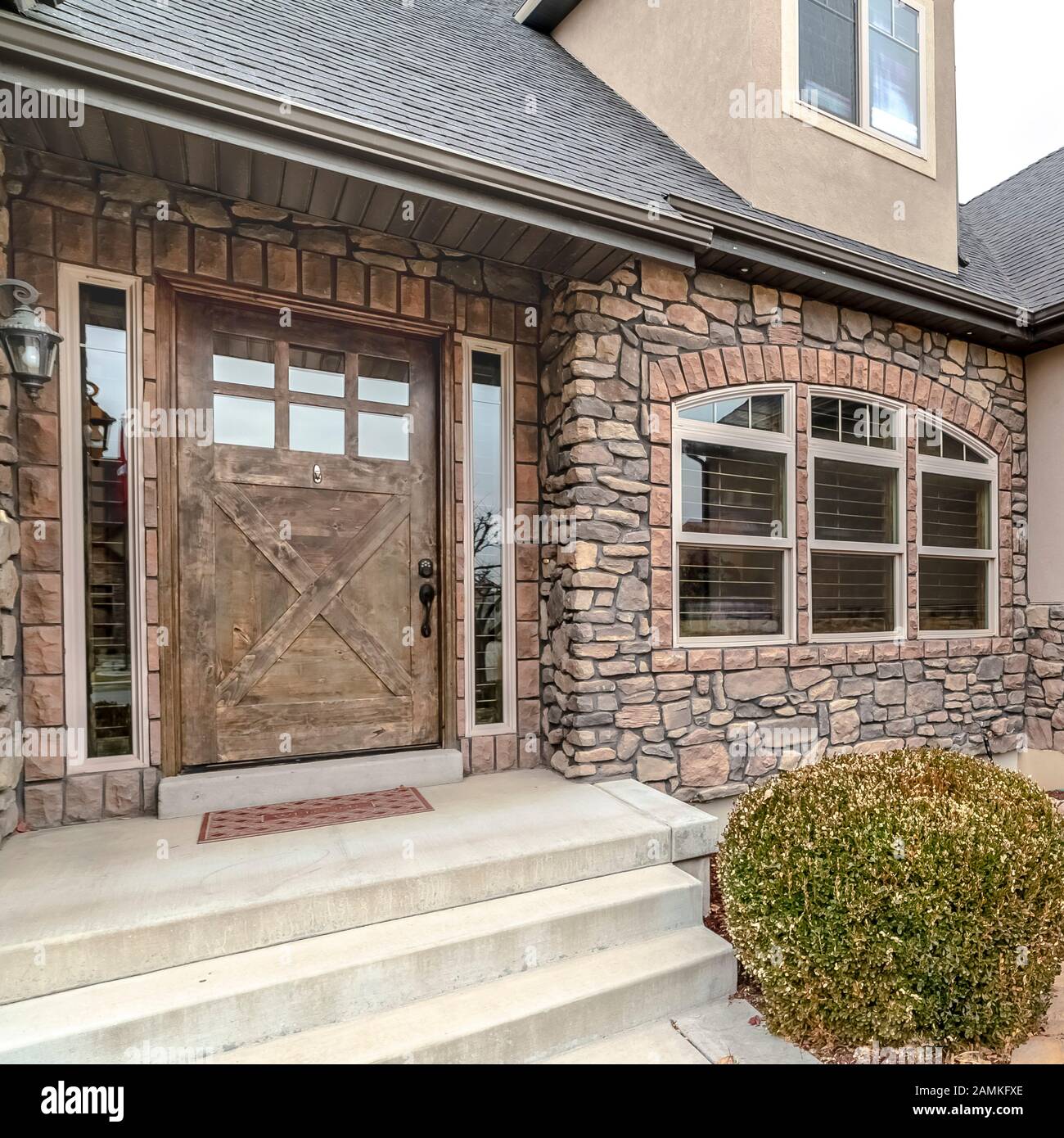 Square Modern urban home with feature stone brick wall Stock Photo - Alamy