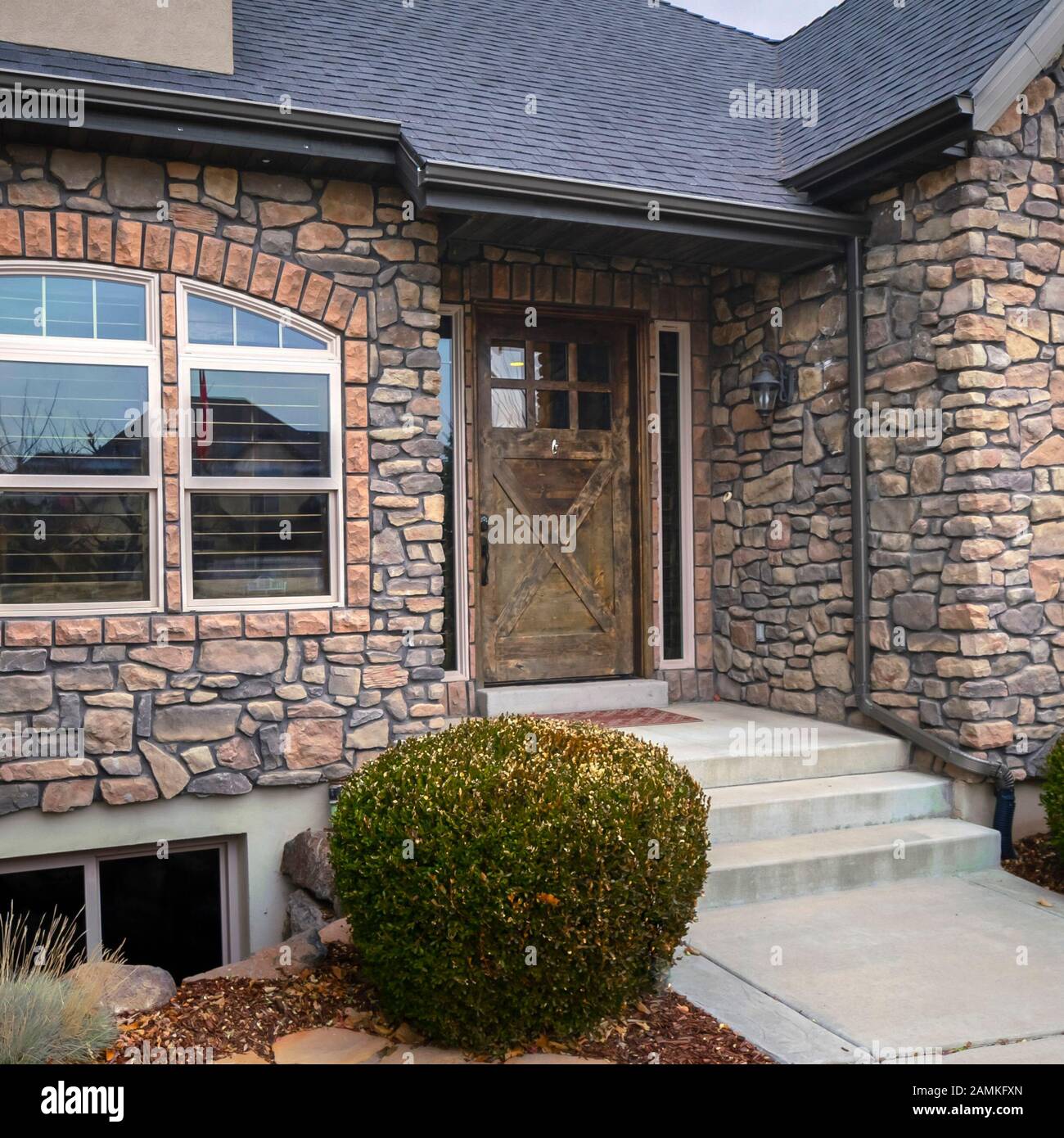 Square frame Neat front footpath and garden to an urban home Stock ...