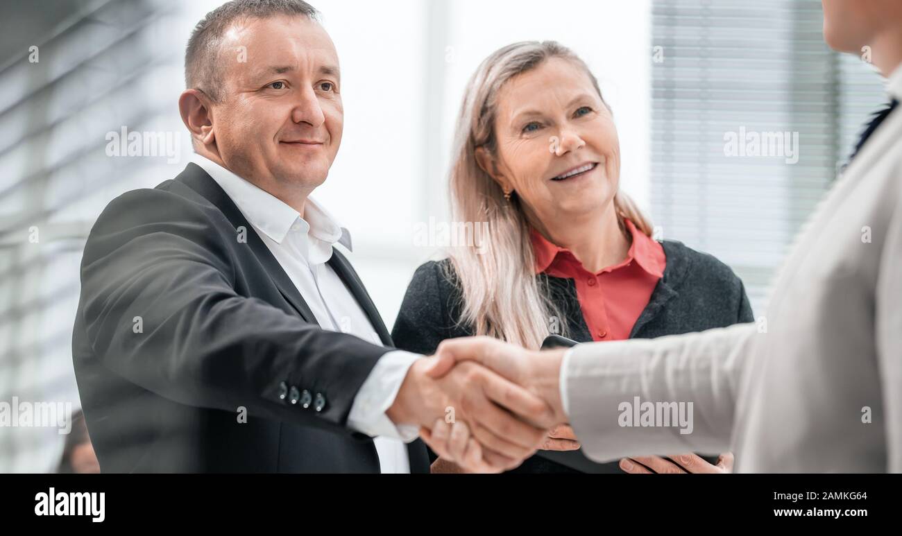 close up. reliable business partners shaking hands Stock Photo - Alamy