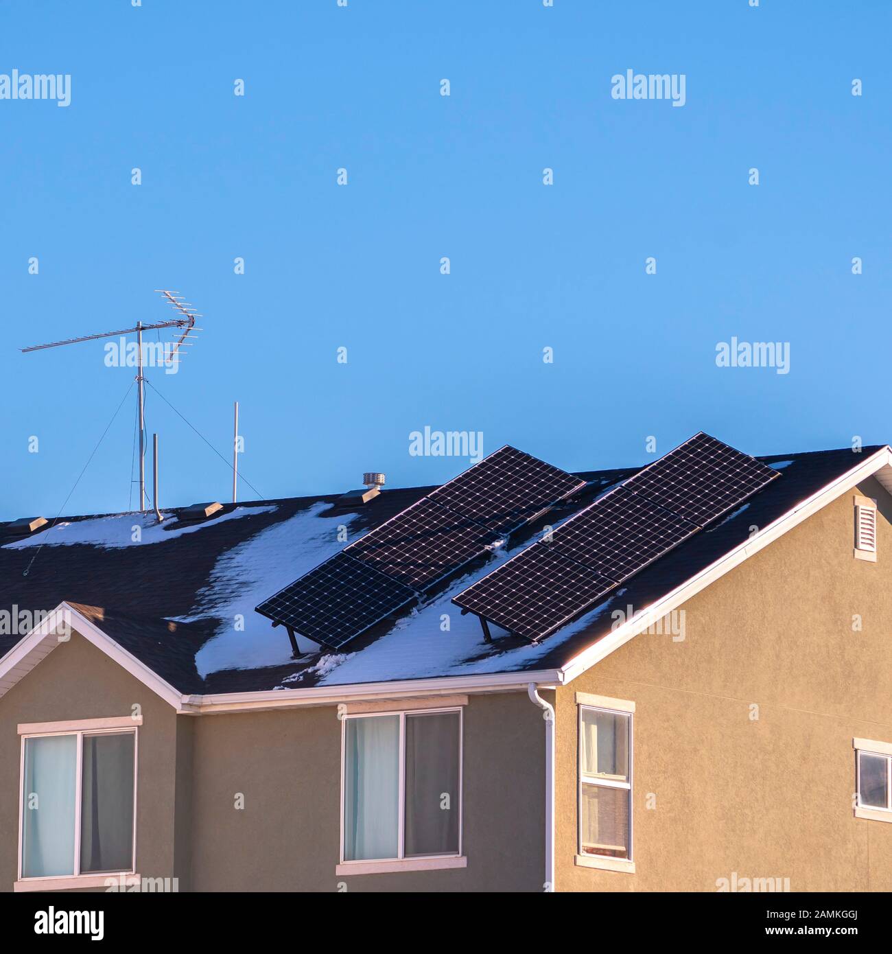Square Two angled solar panels on a house roof Stock Photo - Alamy
