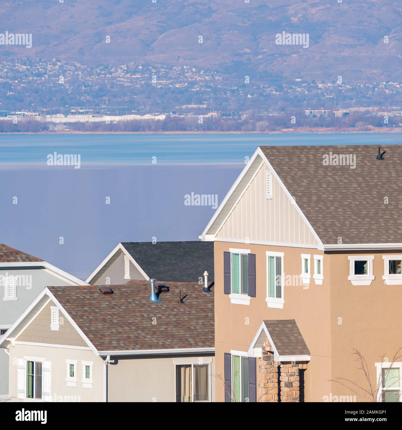 Square View on the street with houses against the lake Stock Photo - Alamy