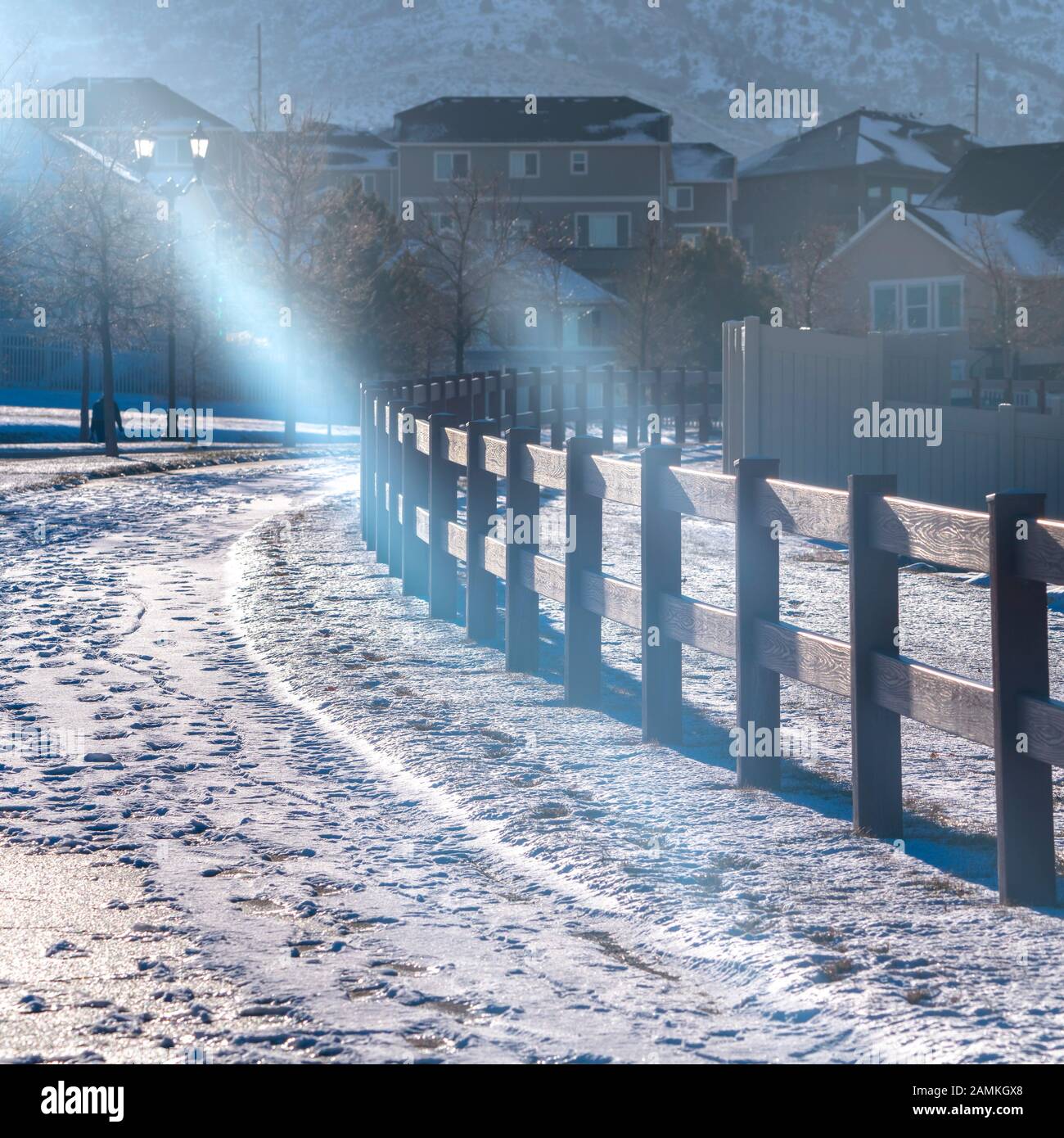 Square Ray of sunlight lighting up a wood roadside fence Stock Photo ...
