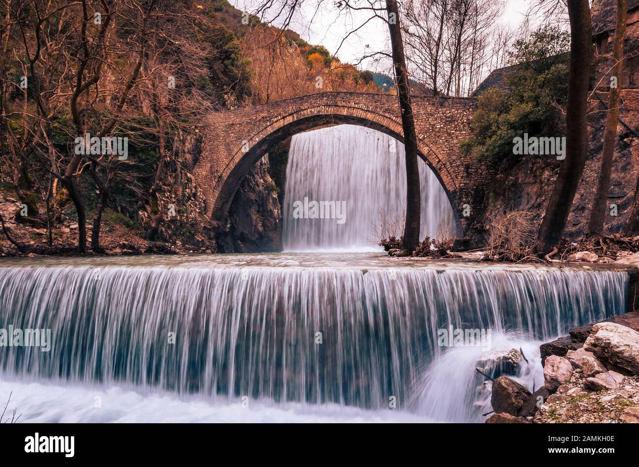The historical stone arched bridge of Palaiokarya with its two ...
