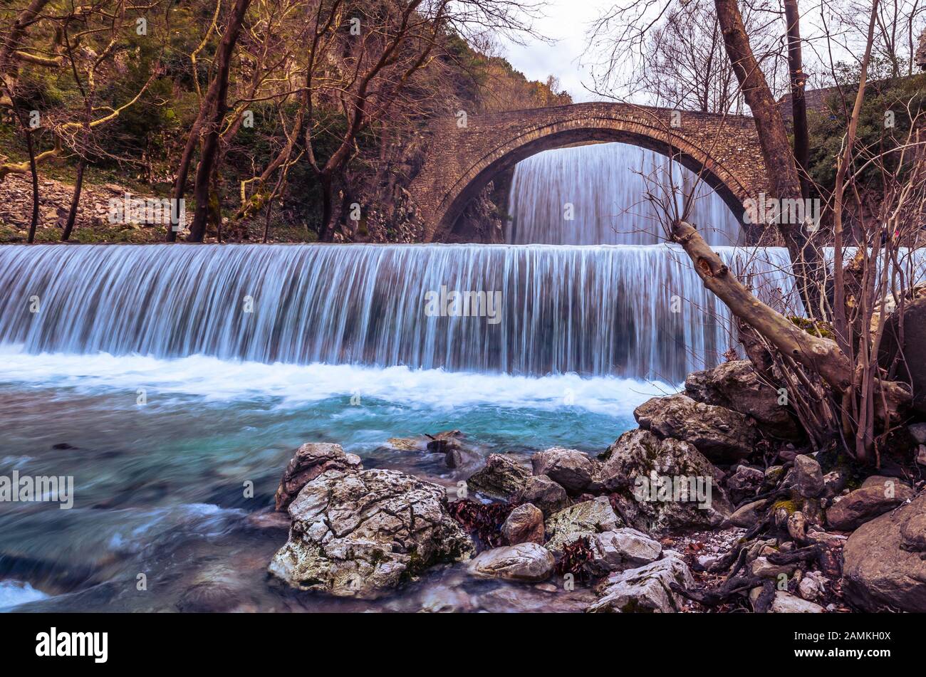 The historical stone arched bridge of Palaiokarya with its two ...