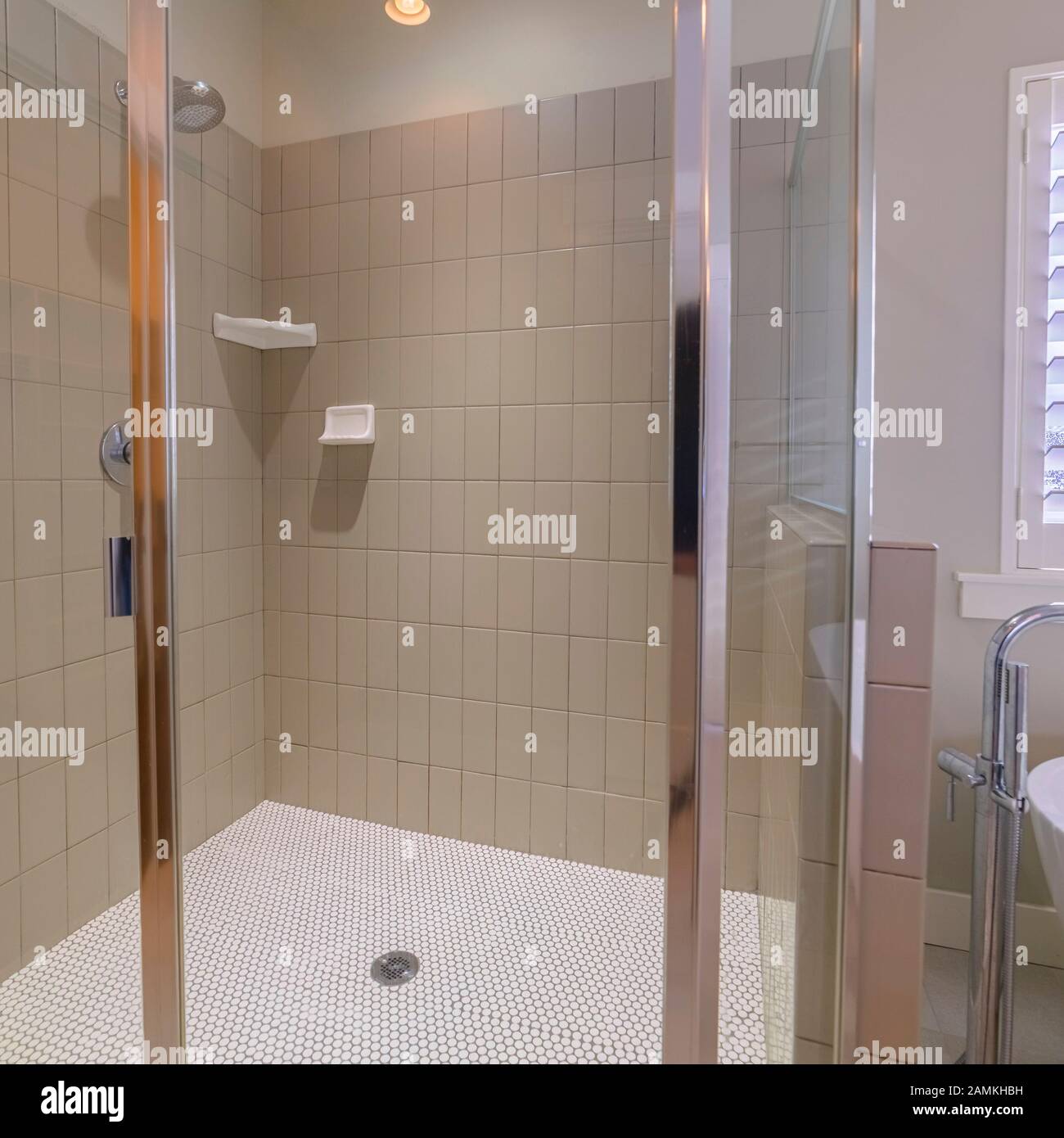 Square frame Modern tiled glass shower cubicle bright interior Stock ...