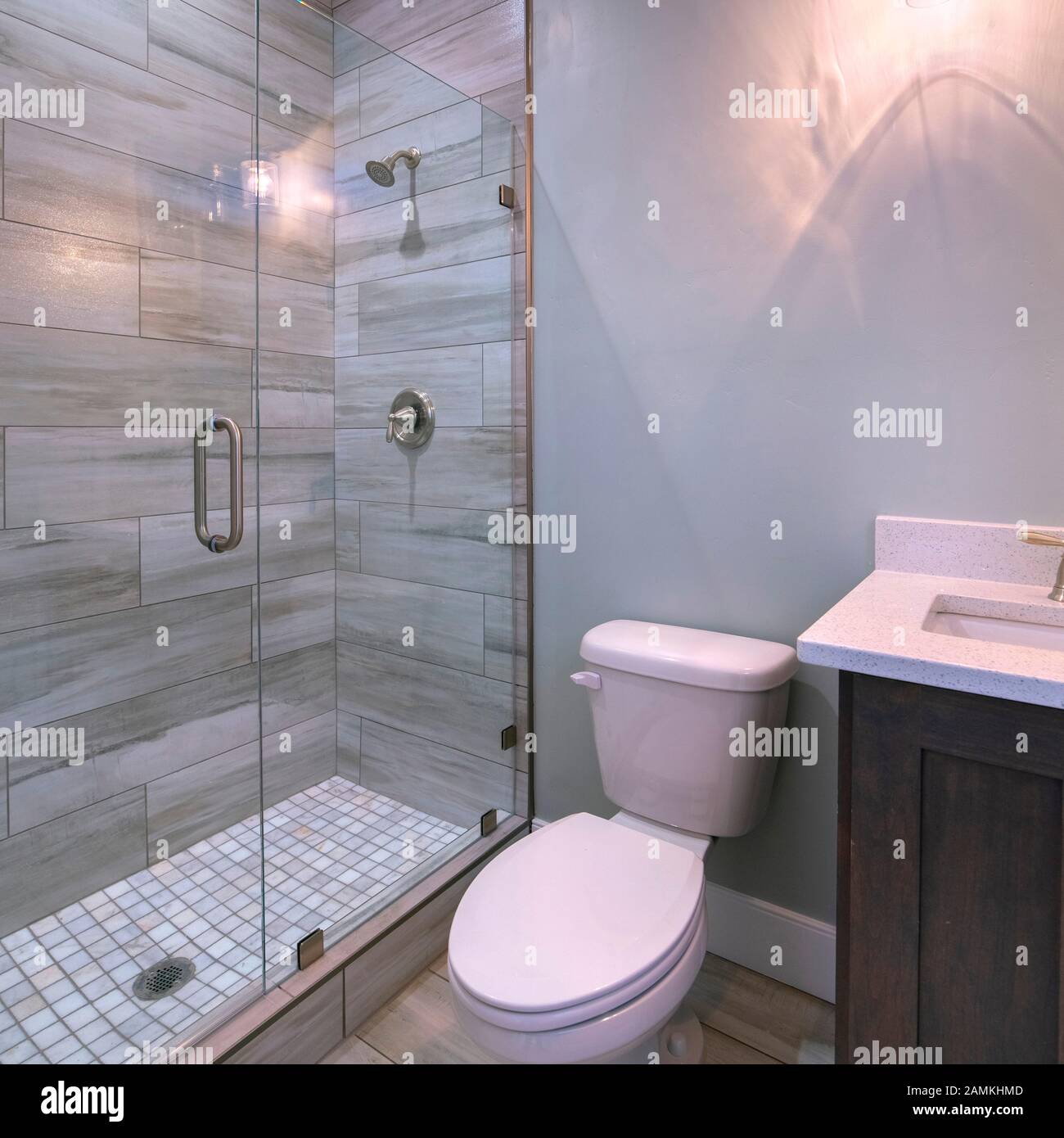 Square Small modern bathroom with shower and toilet Stock Photo - Alamy