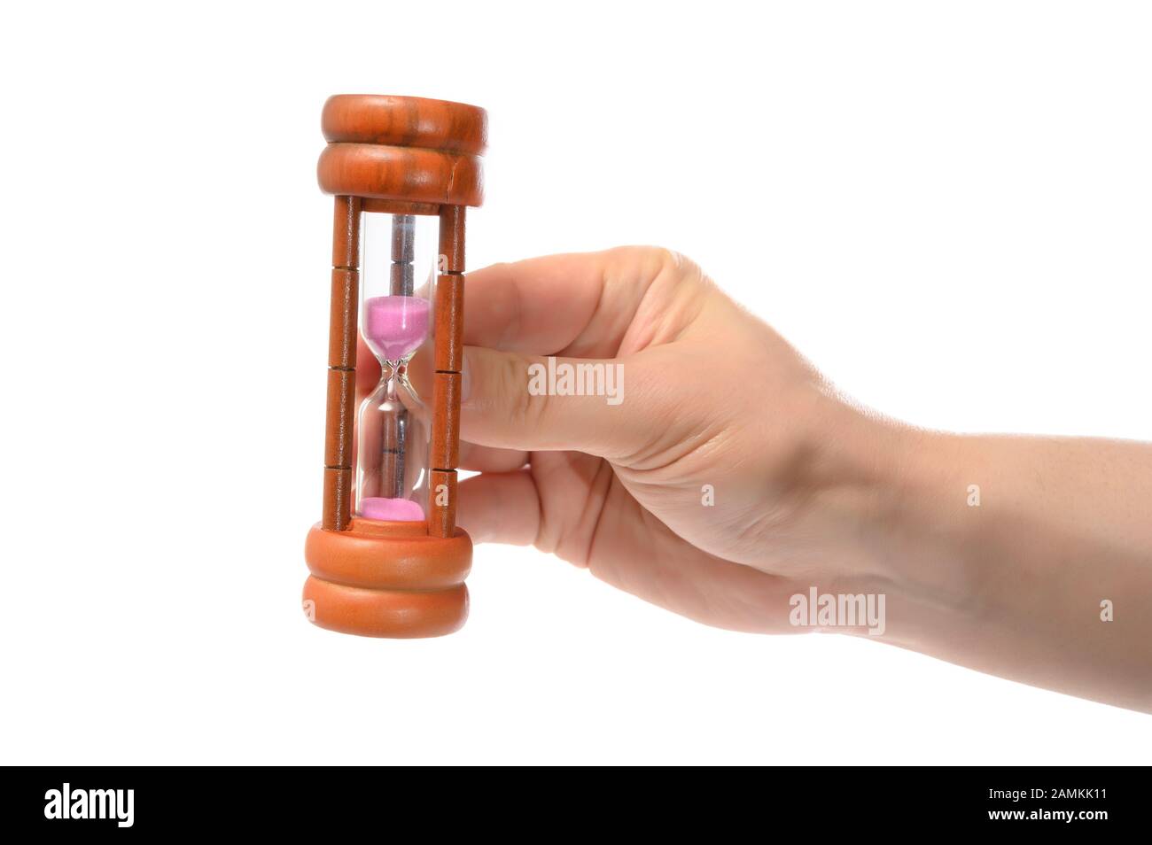 Hand holding an hourglass isolated on white background Stock Photo - Alamy