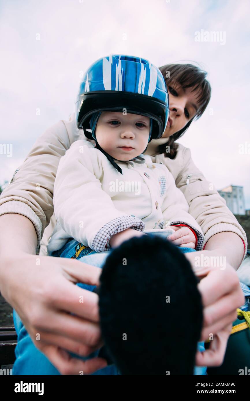 Mom helping child get dressed hi-res stock photography and images - Alamy