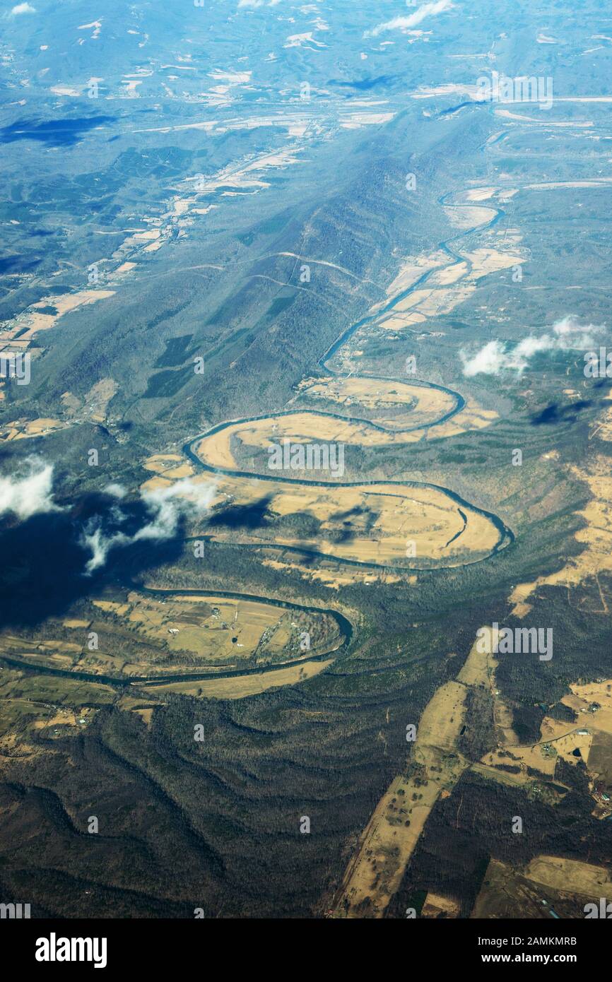 The winding channel of the river. Photo taken from an airplane window ...