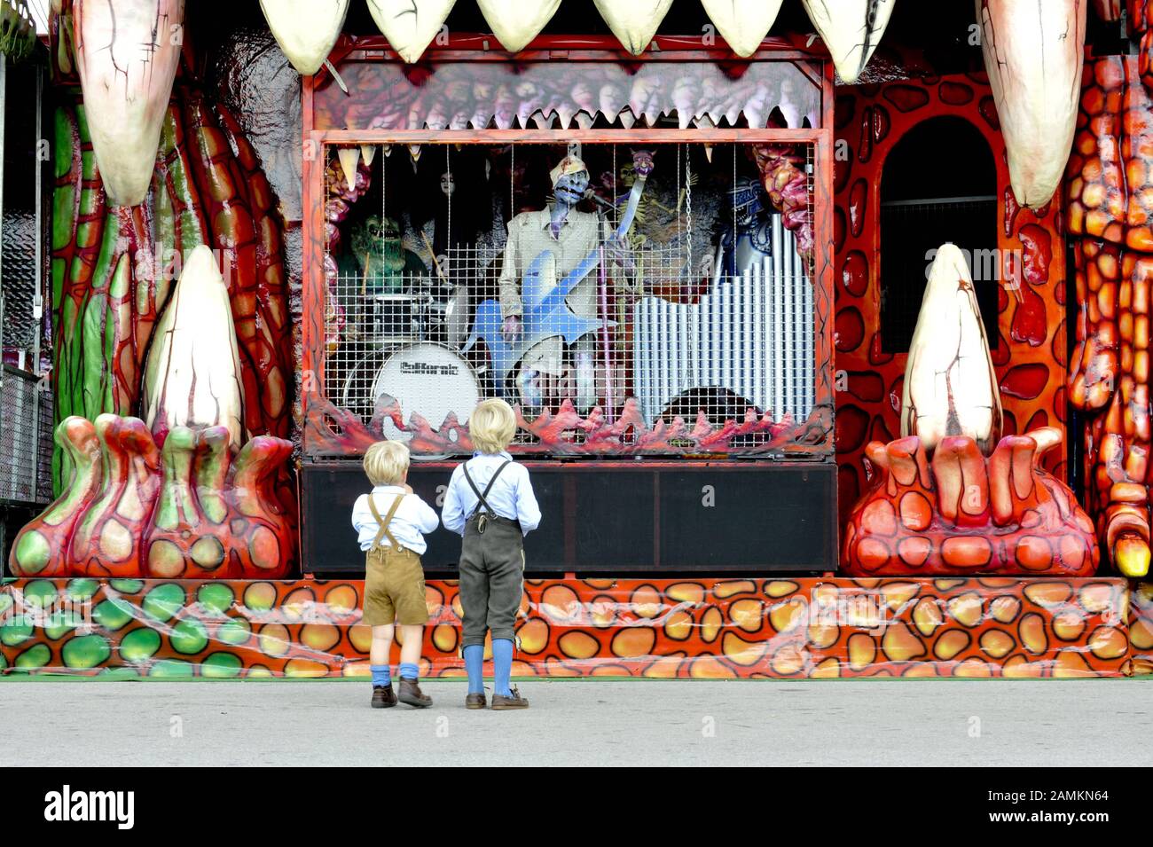 Children watch the ghost train "Shocker" with living ghosts at the ...