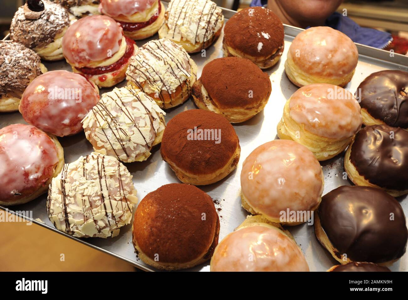 Many different kinds of doughnuts in the display of the Cafe Rischart ...