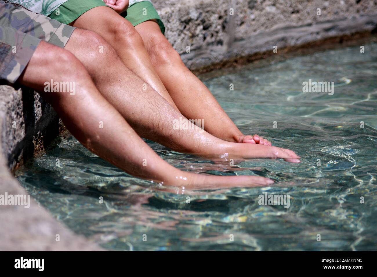 Visitors to the Hofgarten stretch their legs to cool off in the ...