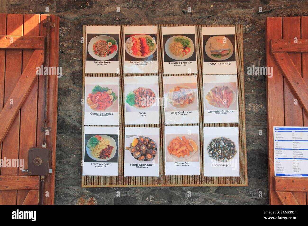 Tourist menu with pictures of the respective menus on the wall of a ...
