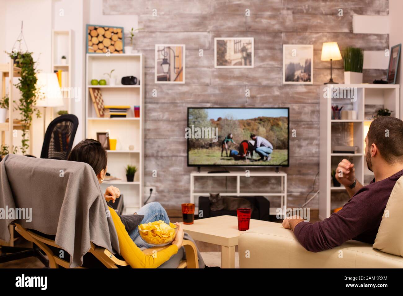 Two men watching tv rear view hi-res stock photography and images - Alamy