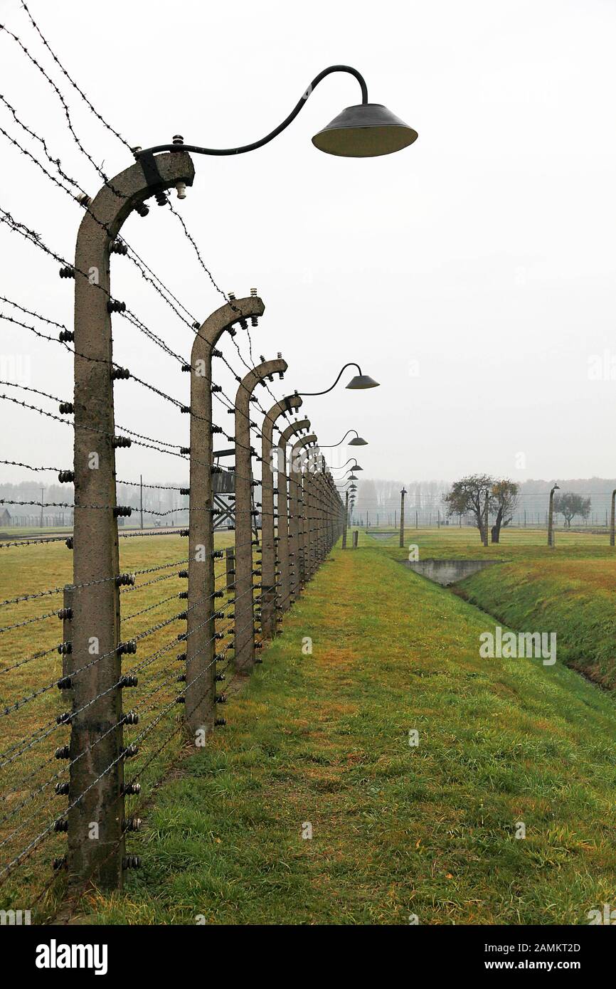 Lamp and barbed wire fence at the memorial site in the former ...